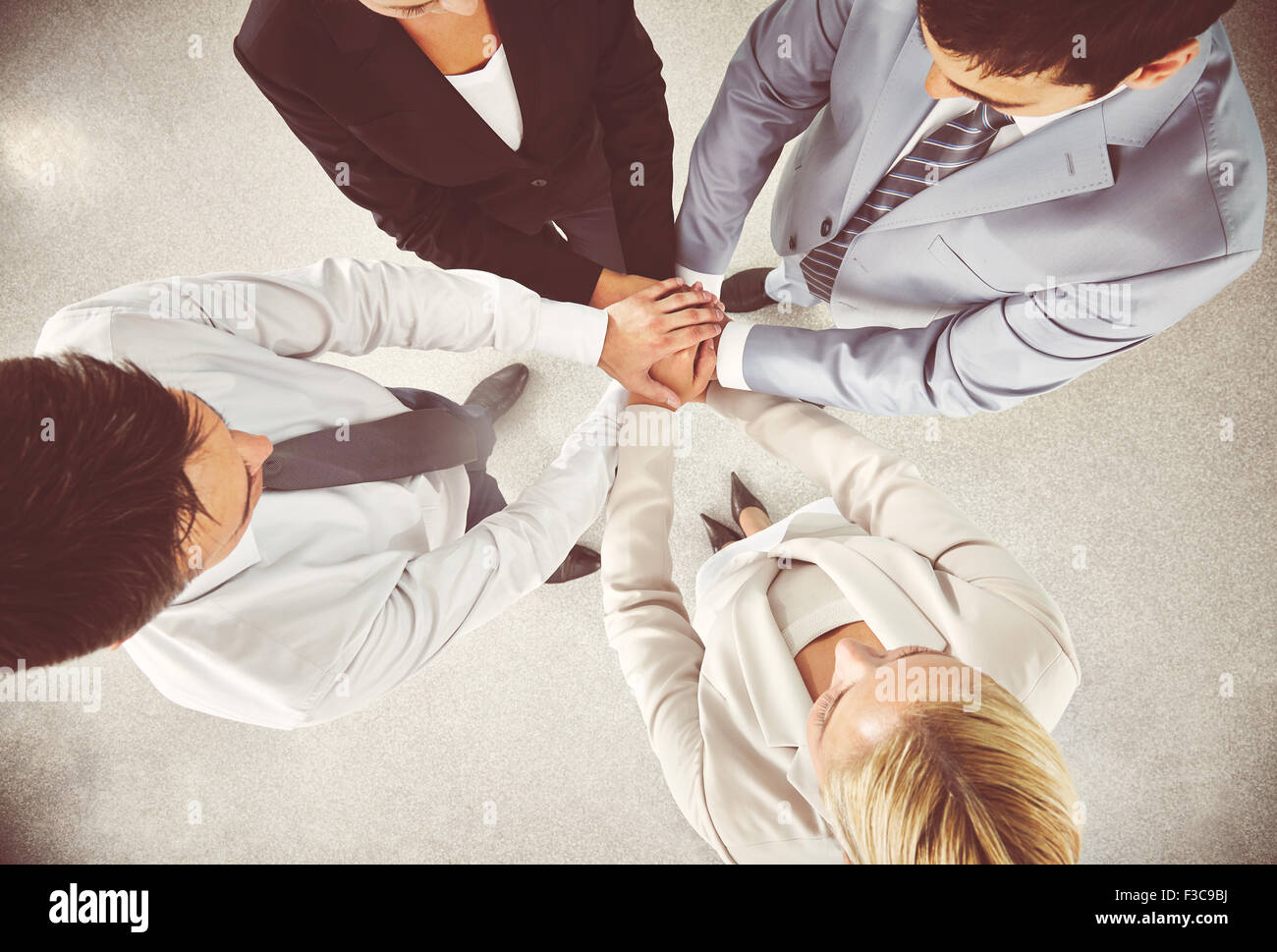 Business team keeping their hands in pile Stock Photo - Alamy