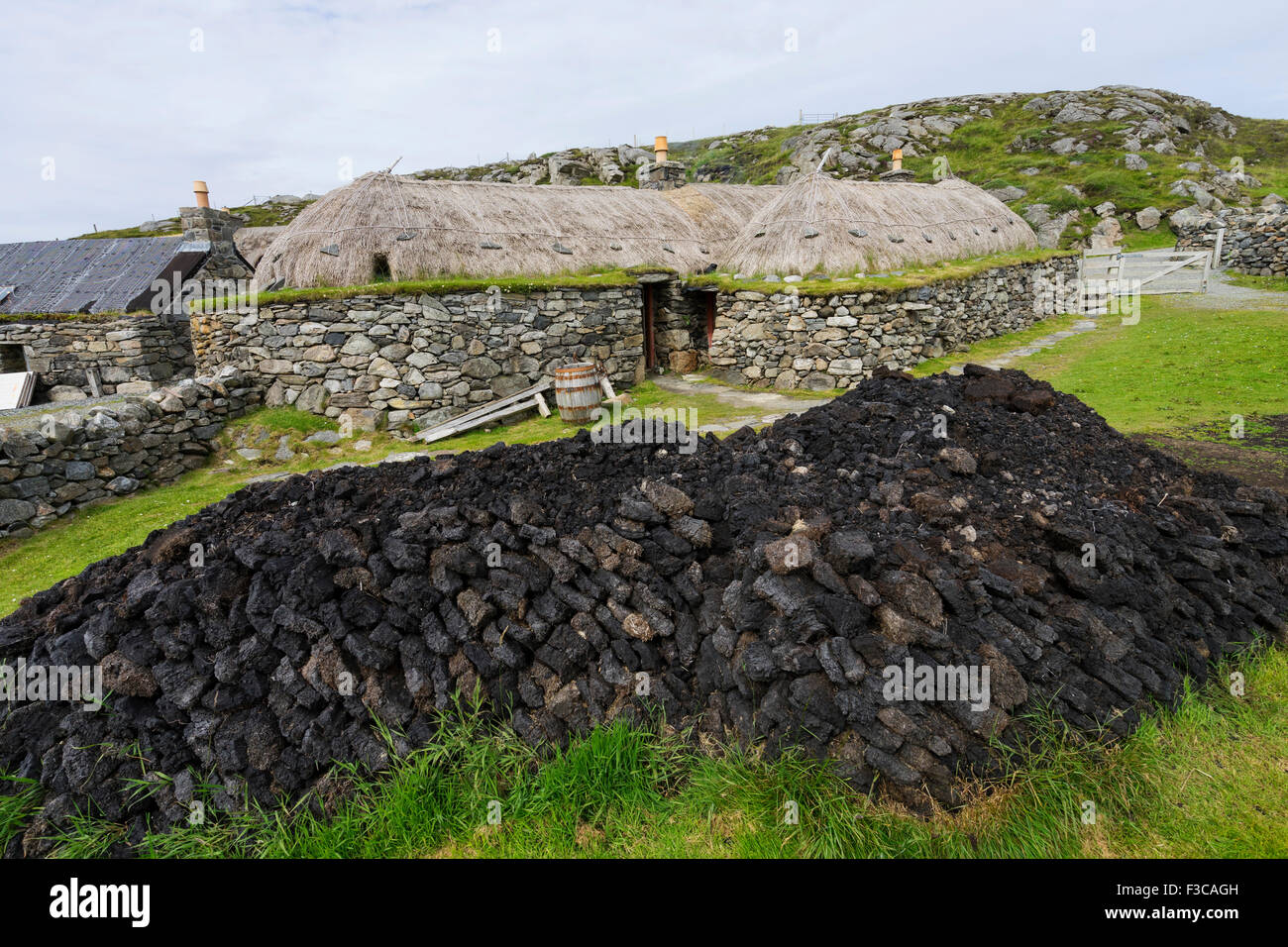Traditional blackhouse cottage and peat supply at Gearrannan blackhouse ...