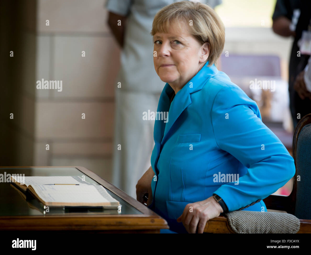 New Delhi, India. 05th Oct, 2015. German Chancellor Angela Merkel signs ...