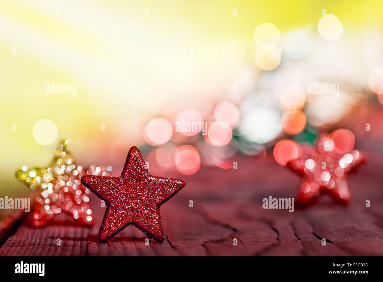 Christmas background with three stars and glitter Stock Photo - Alamy