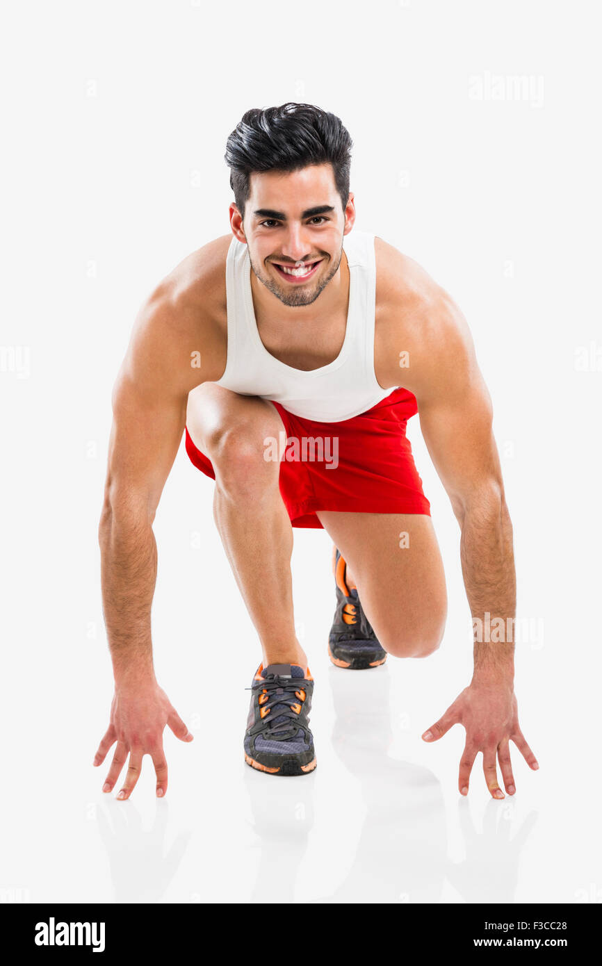 Athletic man ready to running, isolated over a gray background Stock ...