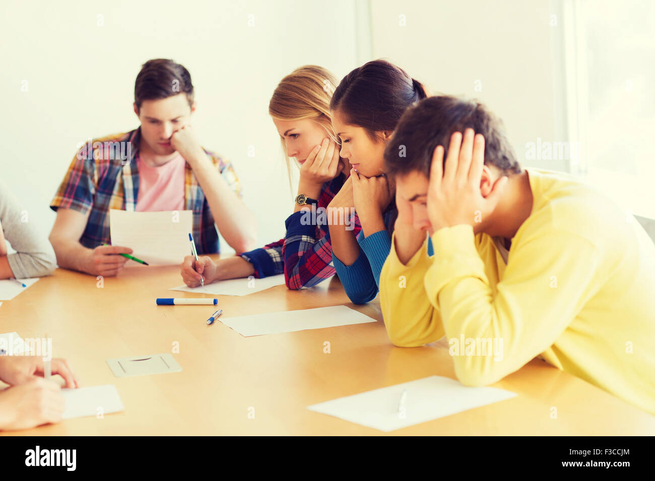 group of students with papers Stock Photo - Alamy