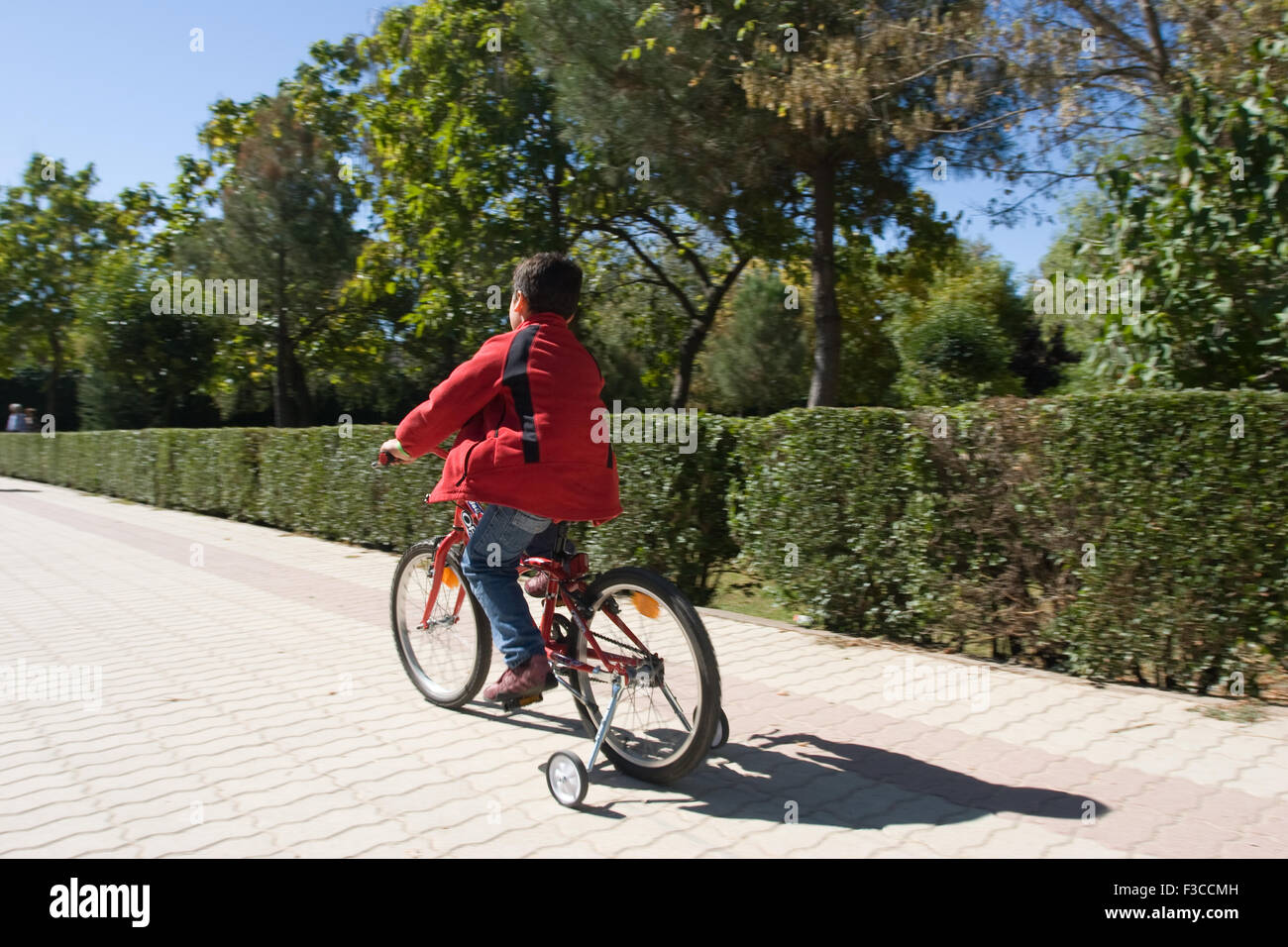 Boy riding bike Stock Photo - Alamy