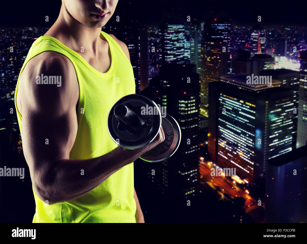 close up of young man with dumbbell flexing biceps Stock Photo - Alamy