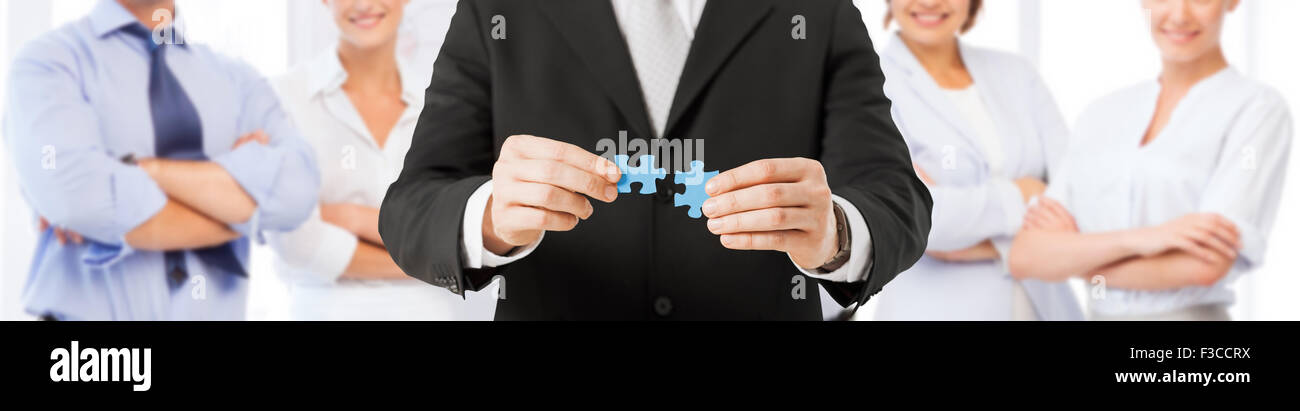 Business team building puzzle pieces hi-res stock photography and ...