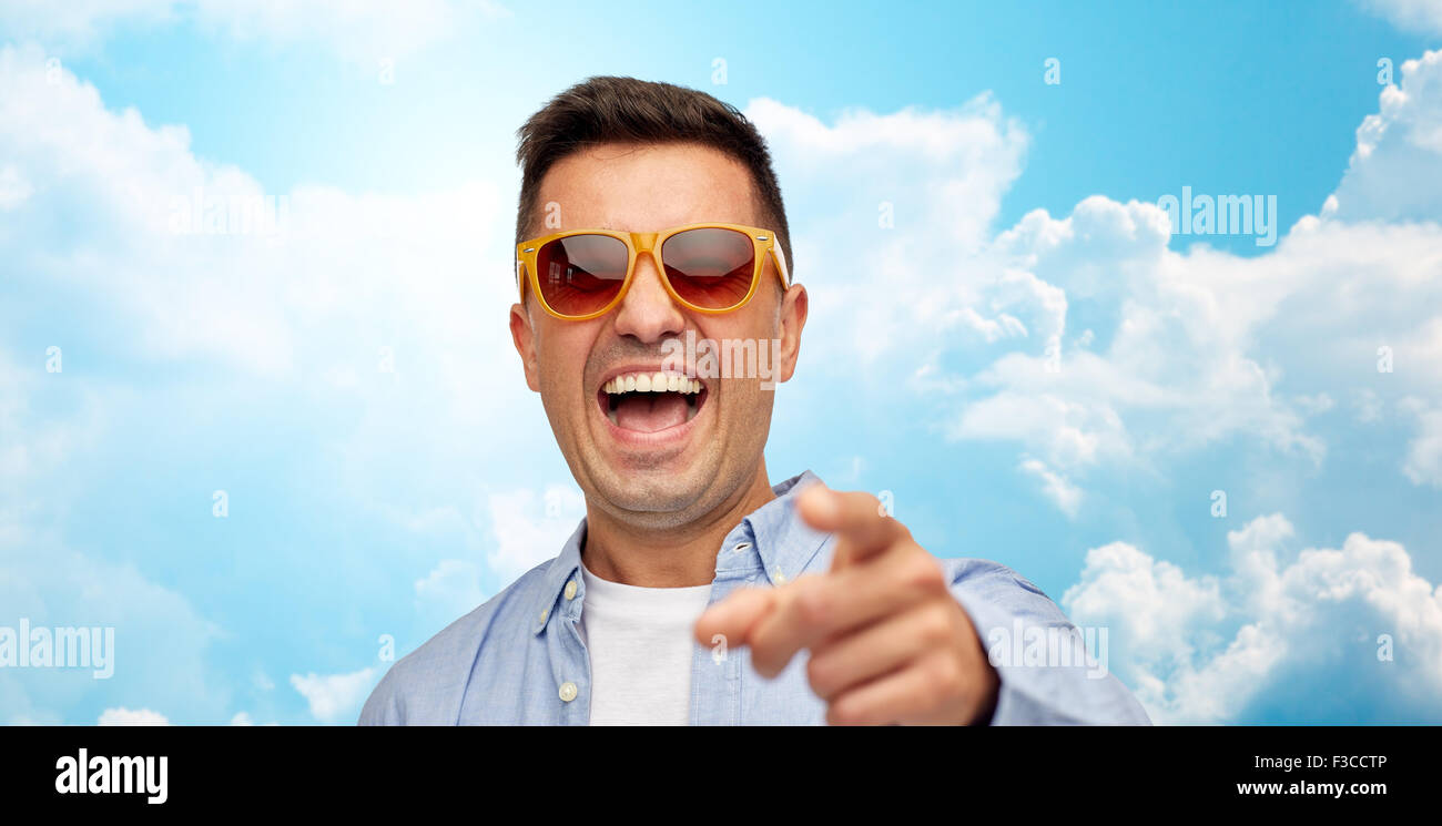 face of laughing man in sunglasses pointing to you Stock Photo - Alamy