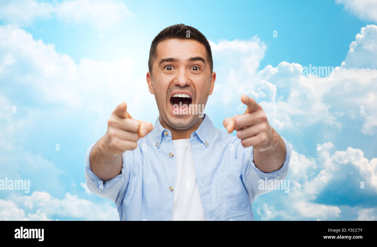 scared man shouting and pointing finger on you Stock Photo - Alamy