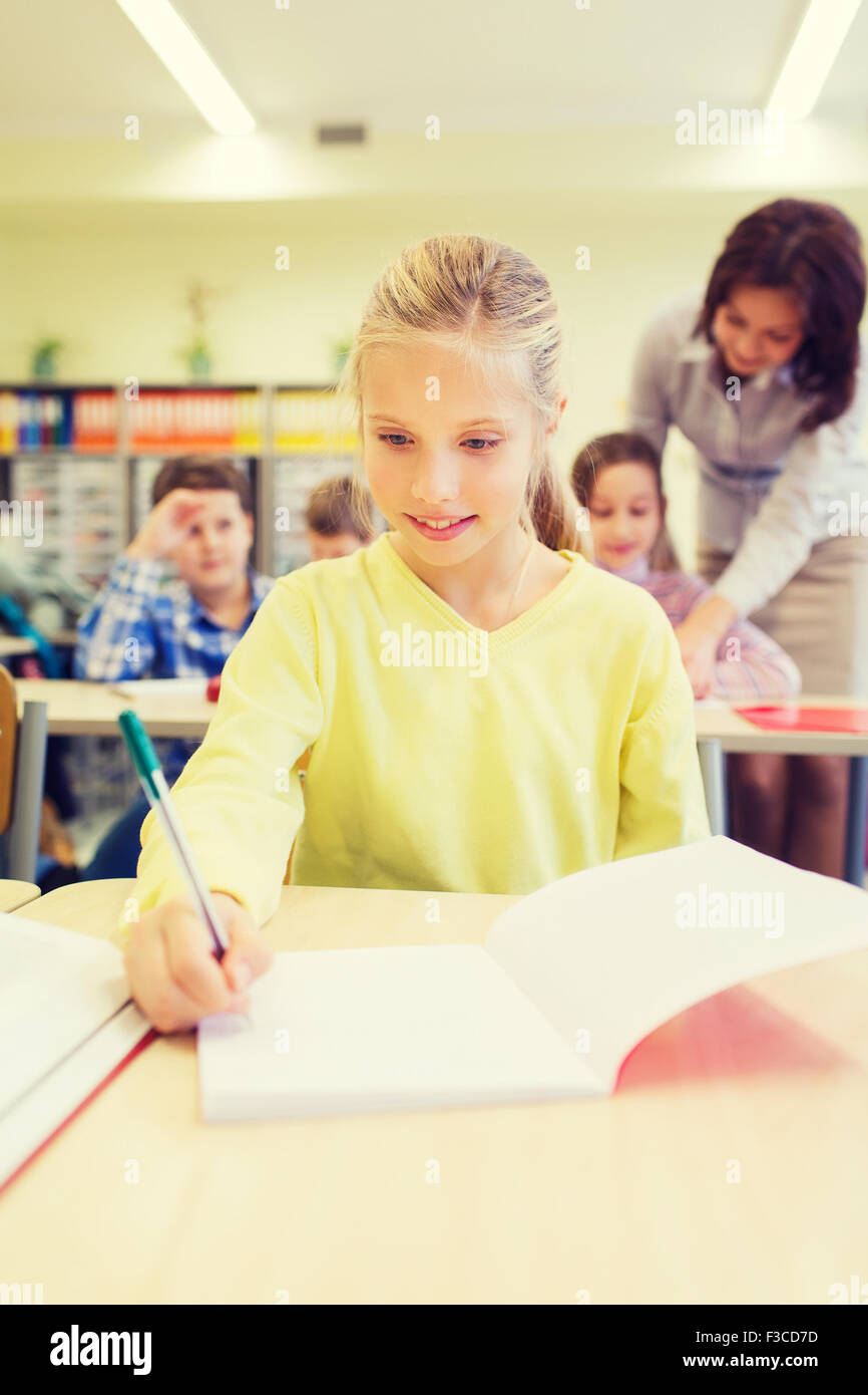group of school kids writing test in classroom Stock Photo - Alamy