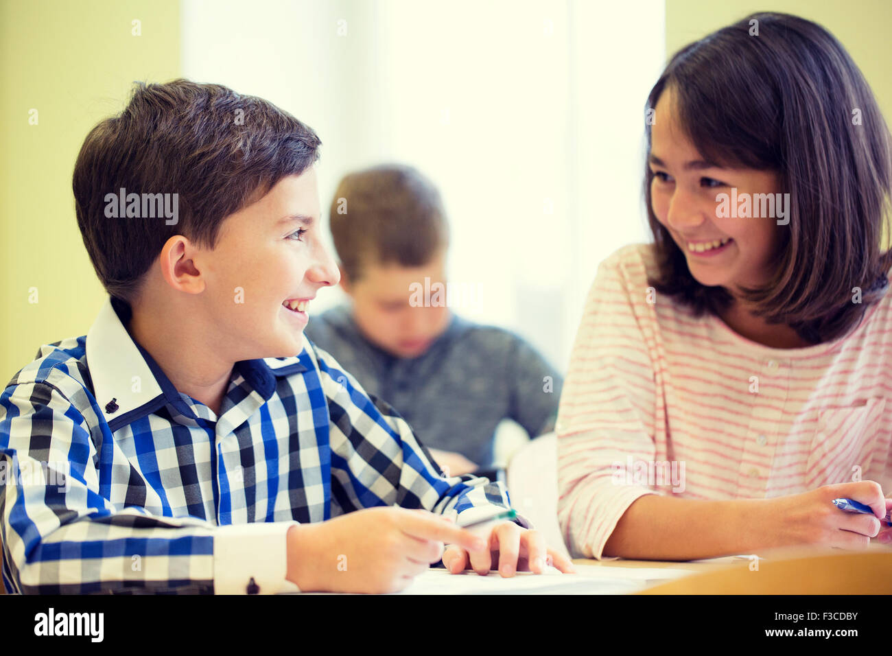 group of school kids writing test in classroom Stock Photo - Alamy