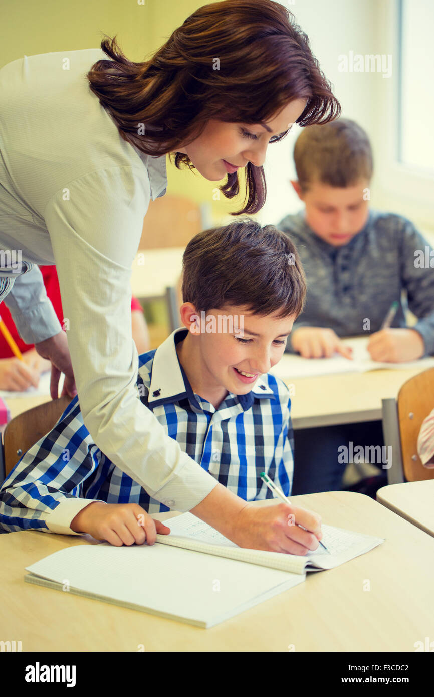 group of school kids writing test in classroom Stock Photo - Alamy