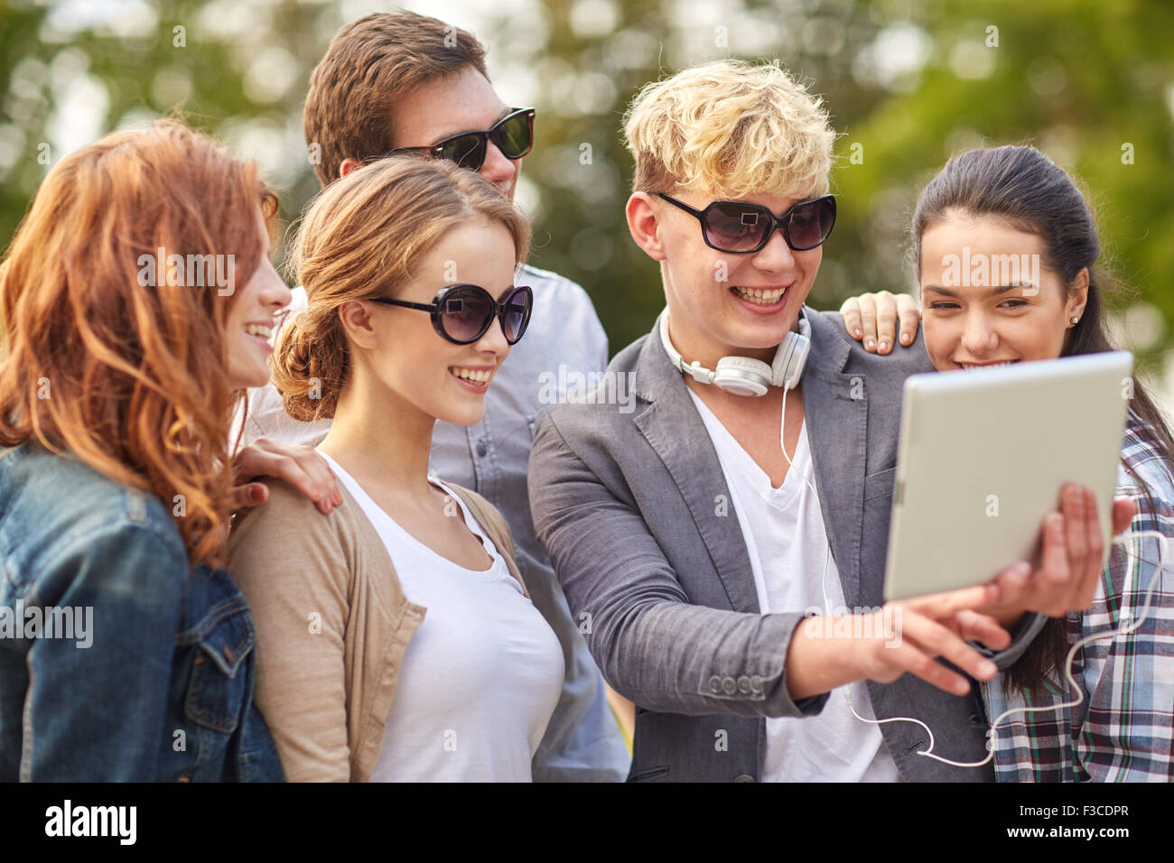 students or teenagers with tablet pc taking selfie Stock Photo - Alamy