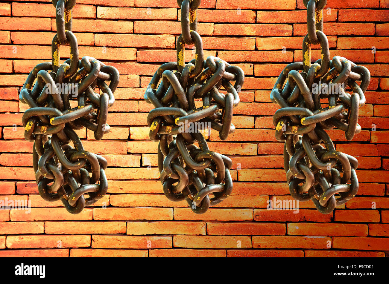 Old chain on brick wall background Stock Photo - Alamy