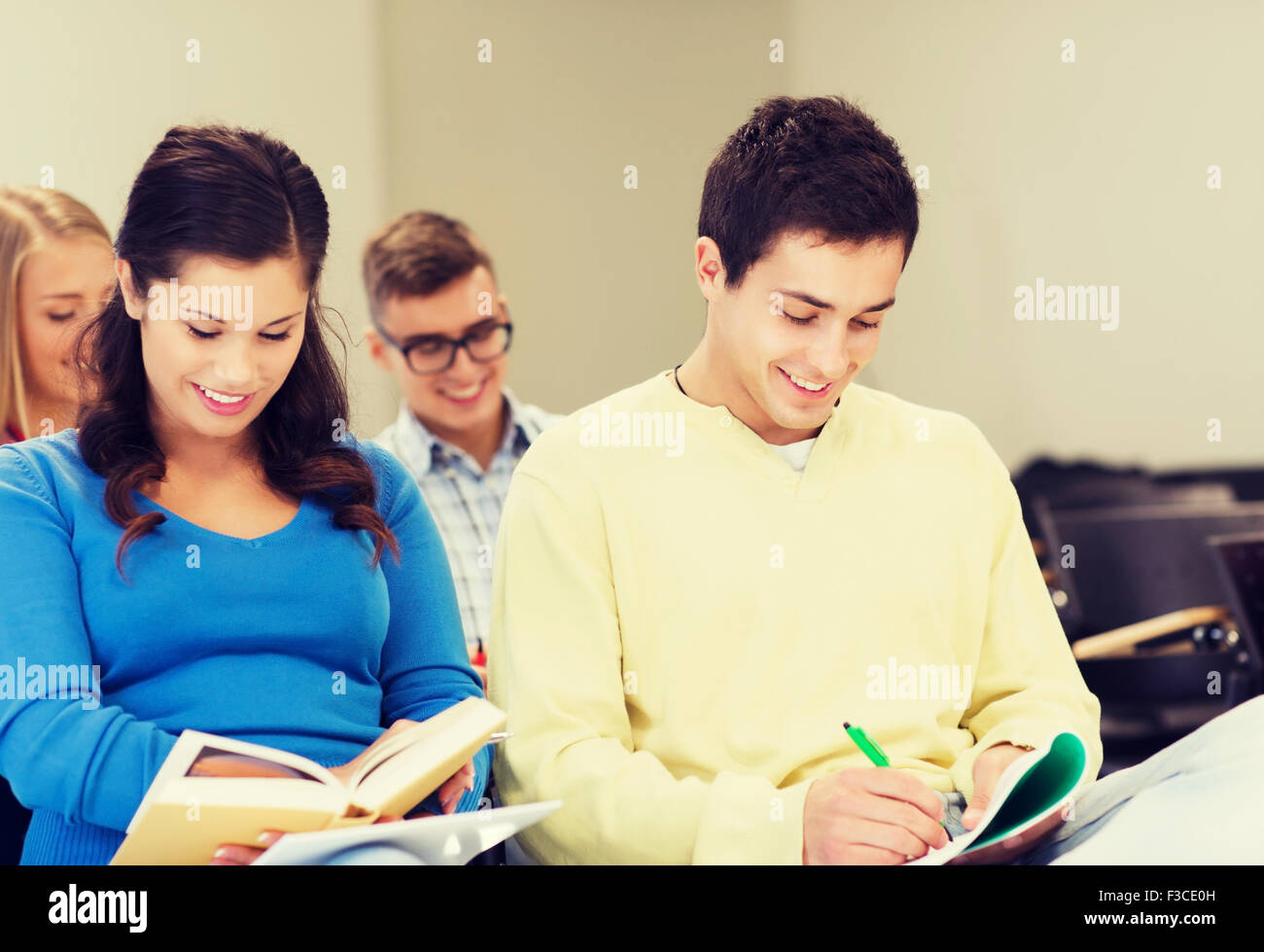 group of smiling students with notebooks Stock Photo - Alamy