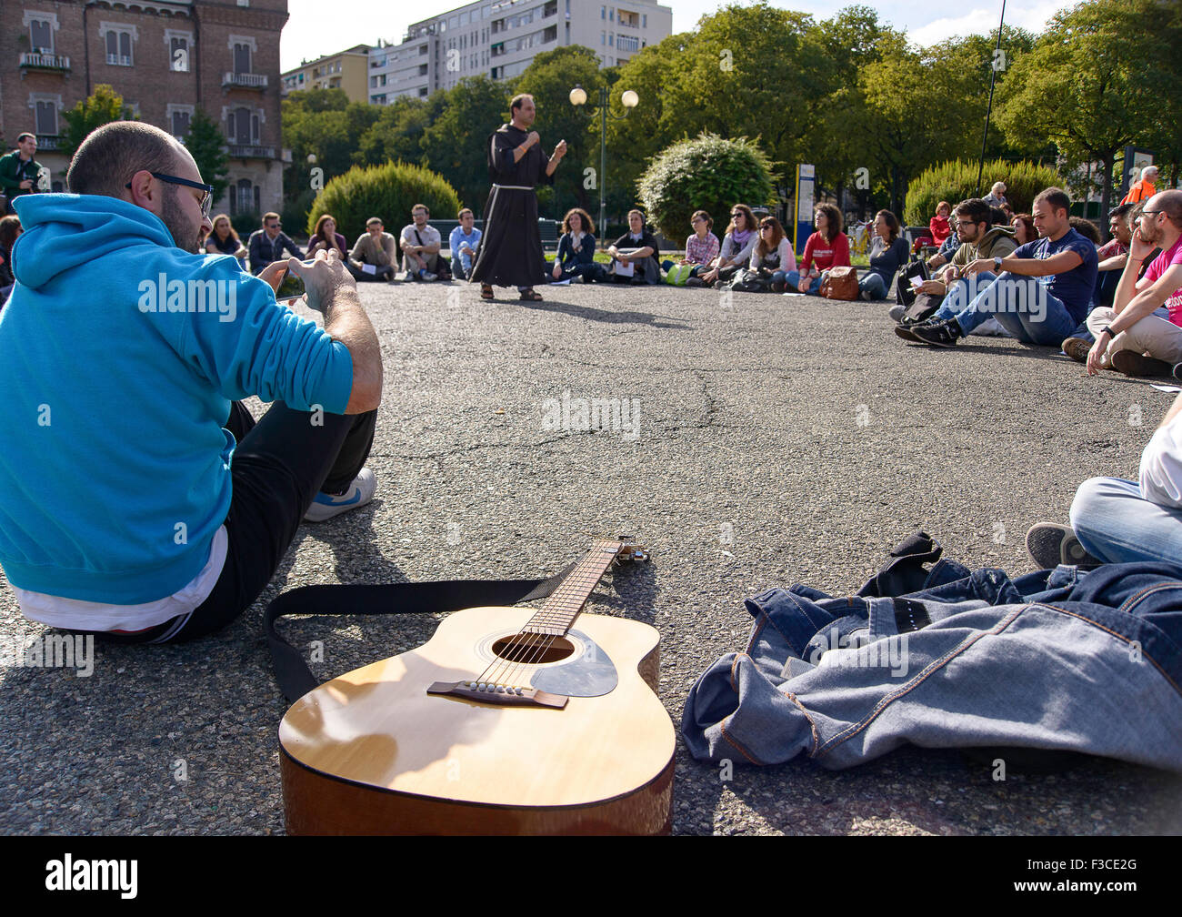 Students sitting on the ground during a march at the beginning of the ...