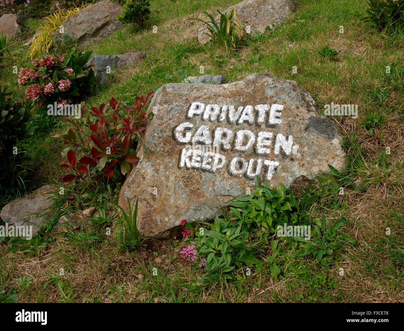Sign painted on rock hi-res stock photography and images - Alamy