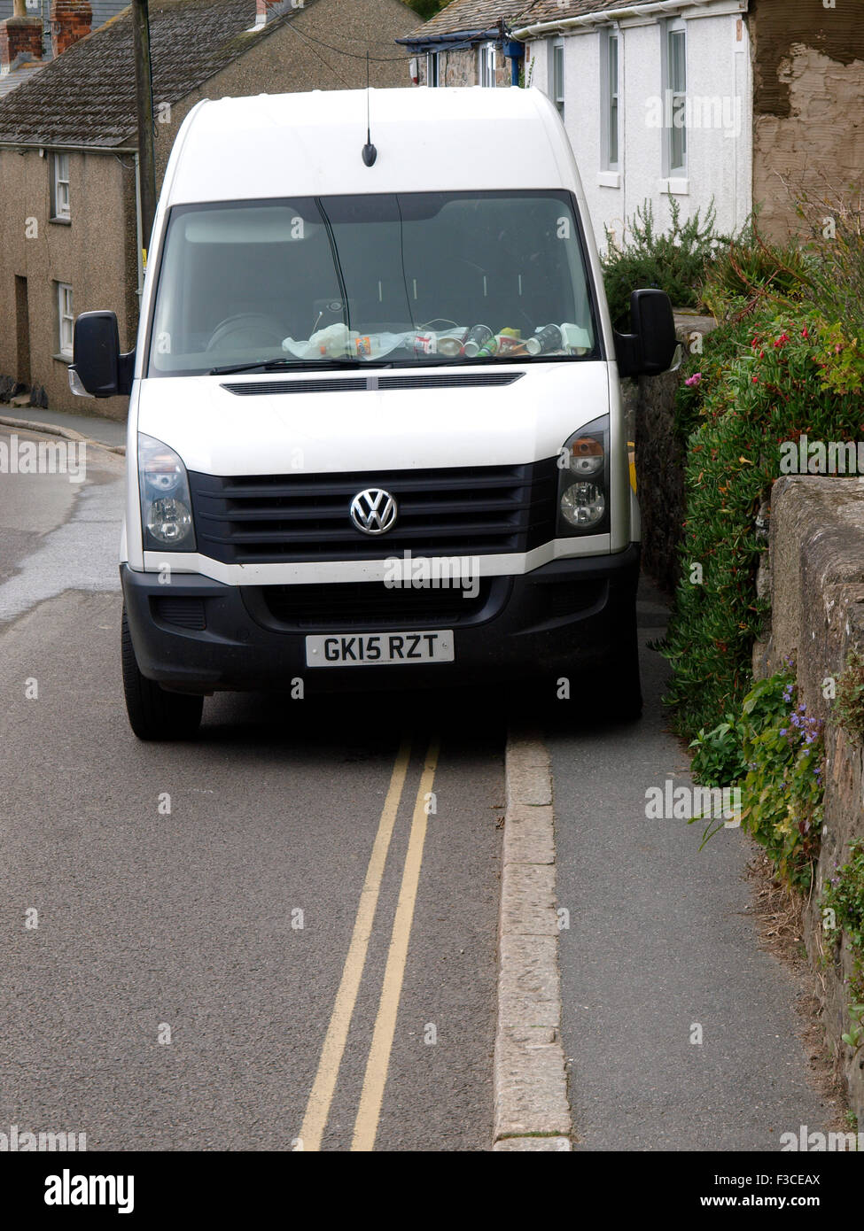 Vehicle parked on pavement blocking the pavement so pedestrians have to ...