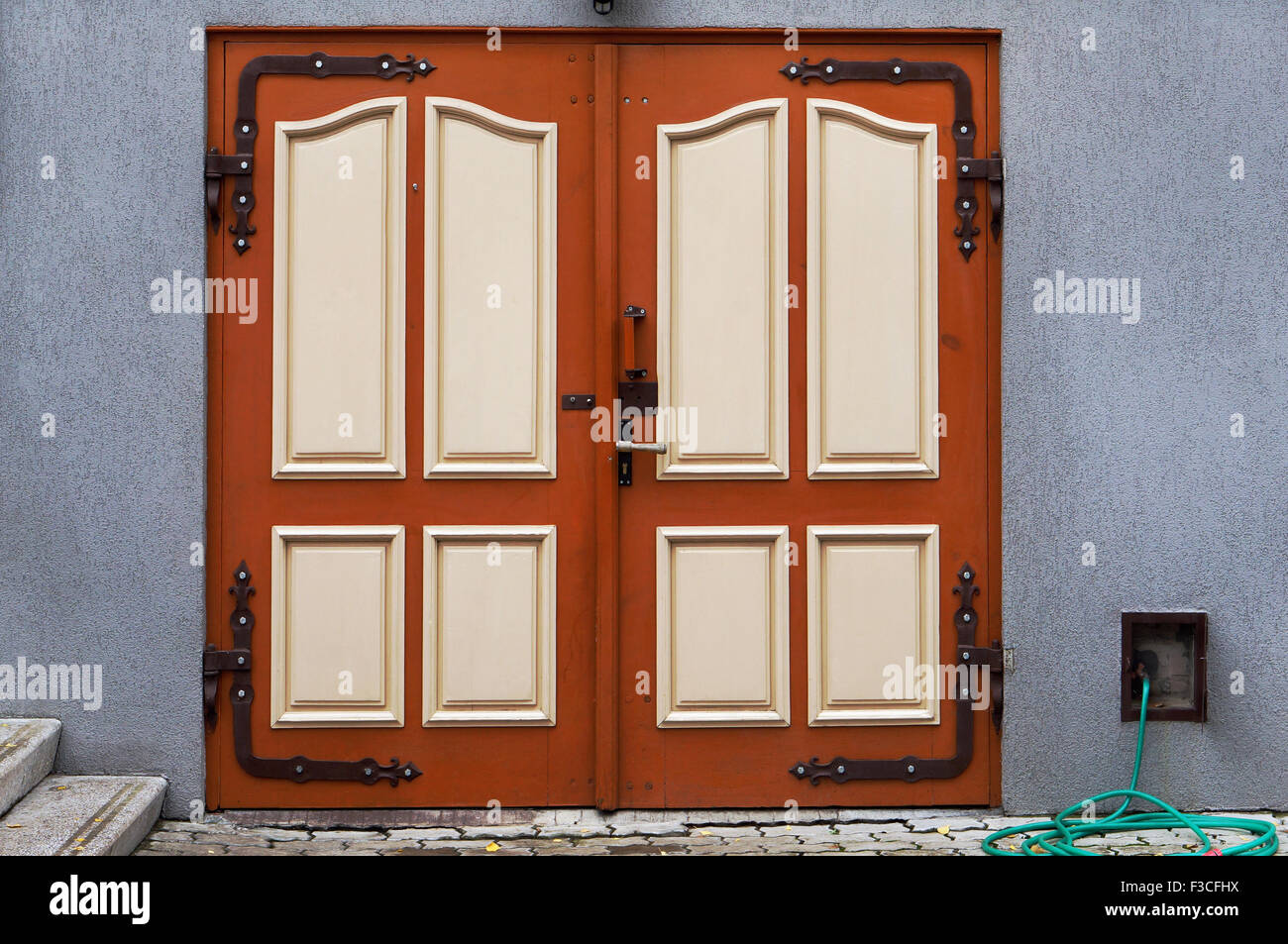 The red armored steel gates door is disguised under the wooden. Mass ...