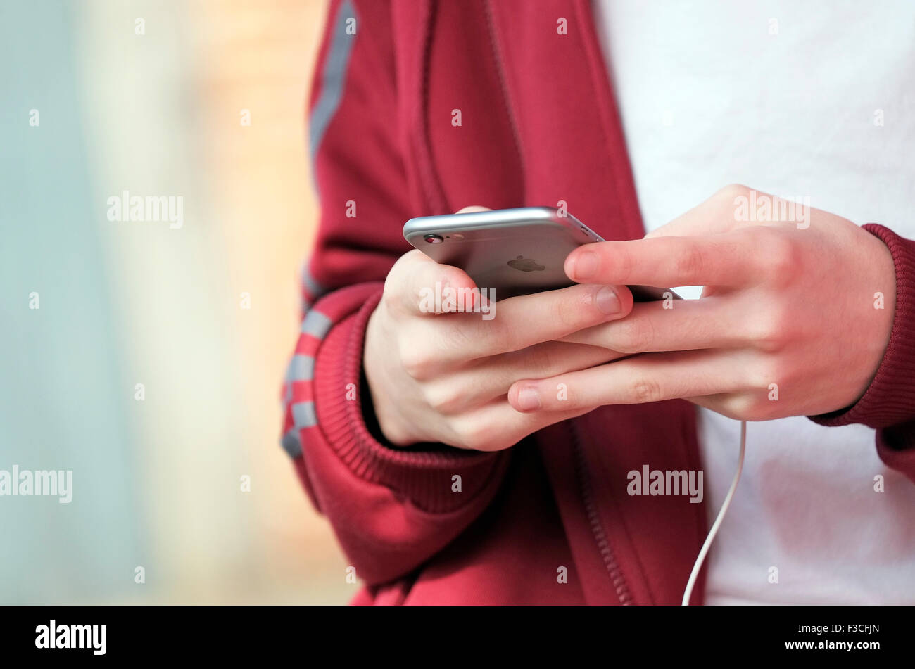 young male teenager using mobile phone Stock Photo - Alamy