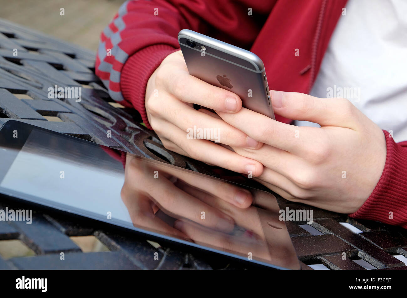 young male teenager using mobile phone Stock Photo - Alamy