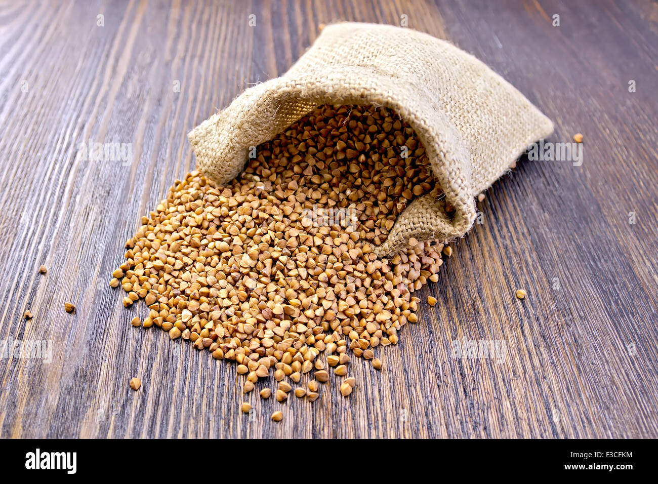 Buckwheat in bag on board Stock Photo - Alamy