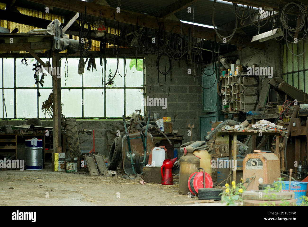 Junk and scrap parts in shed Stock Photo - Alamy