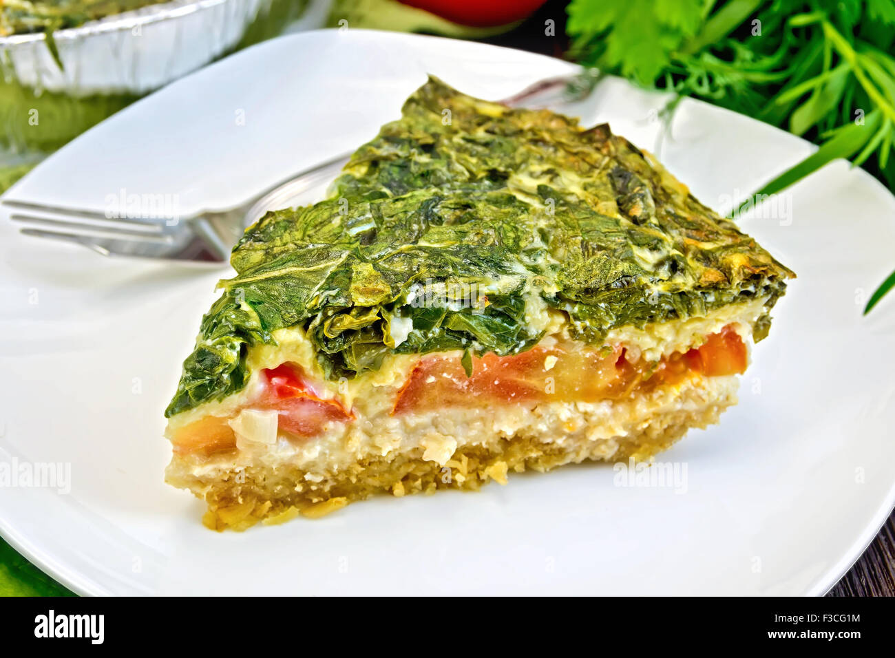 Pie celtic with spinach on table Stock Photo - Alamy