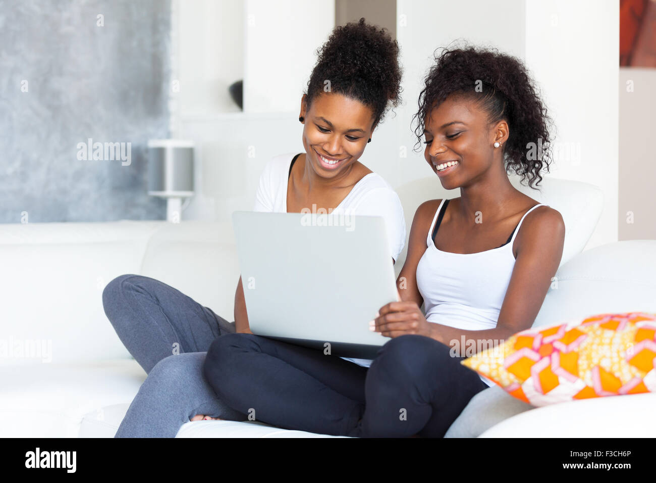 African American student girls using a laptop computer - black people ...