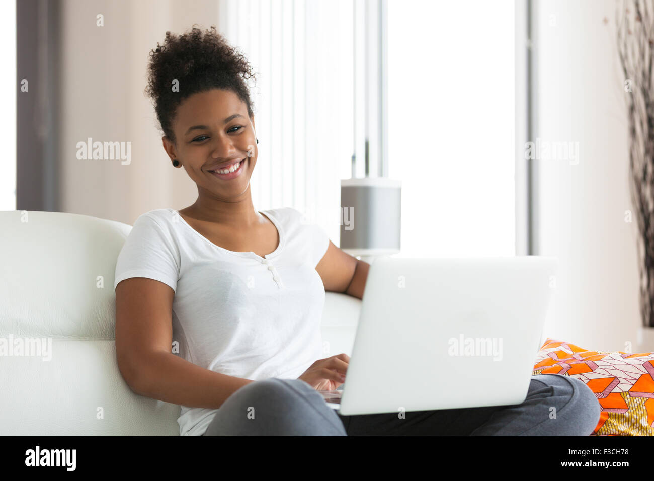 African American student girl using a laptop computer - black people ...