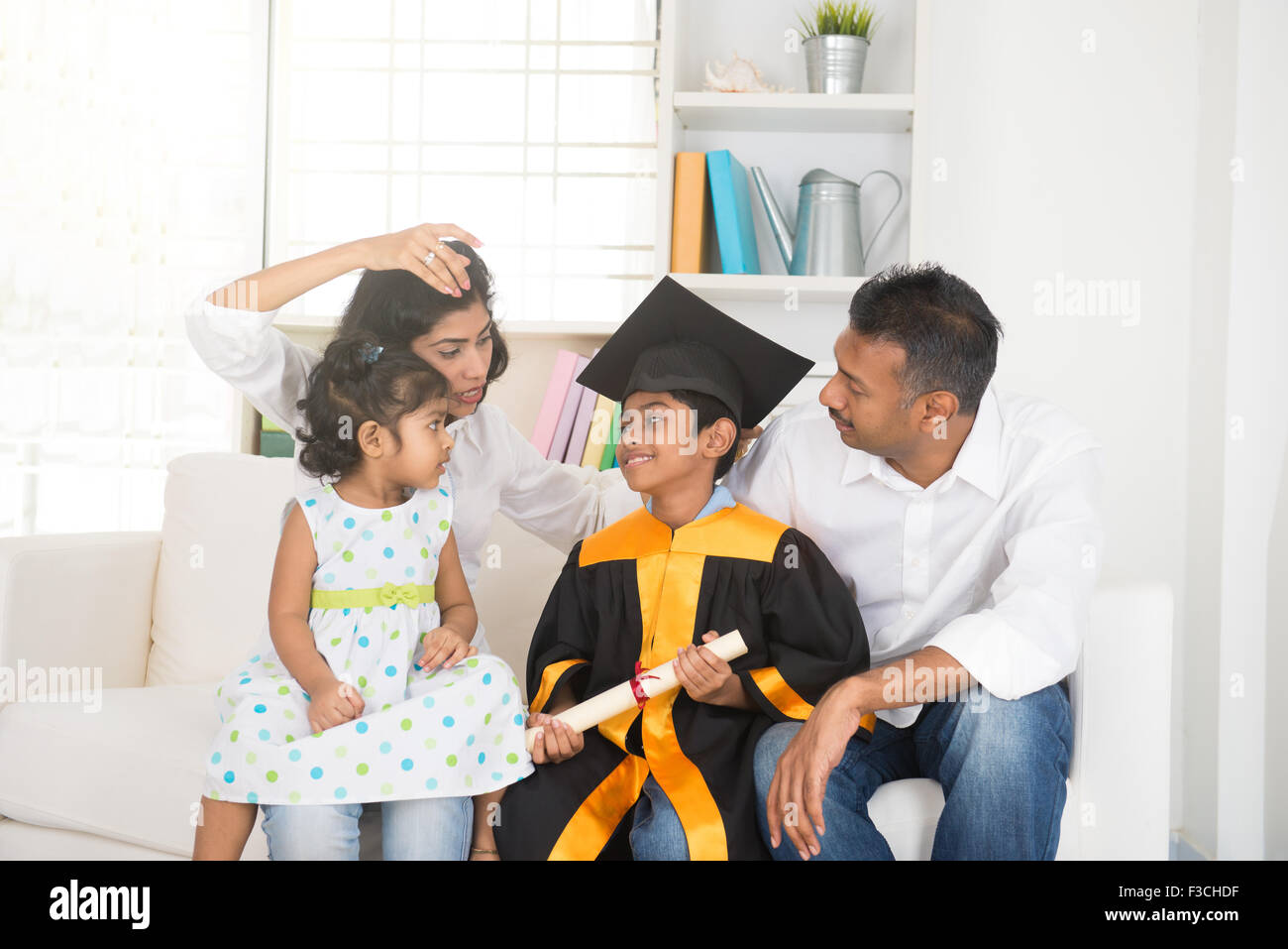 Happy indian family graduation, education concept photo Stock Photo - Alamy