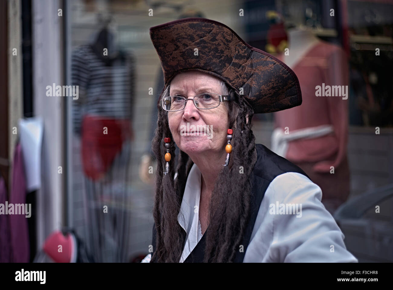 Pirate costume woman. Senior female dressed as a pirate at a street ...