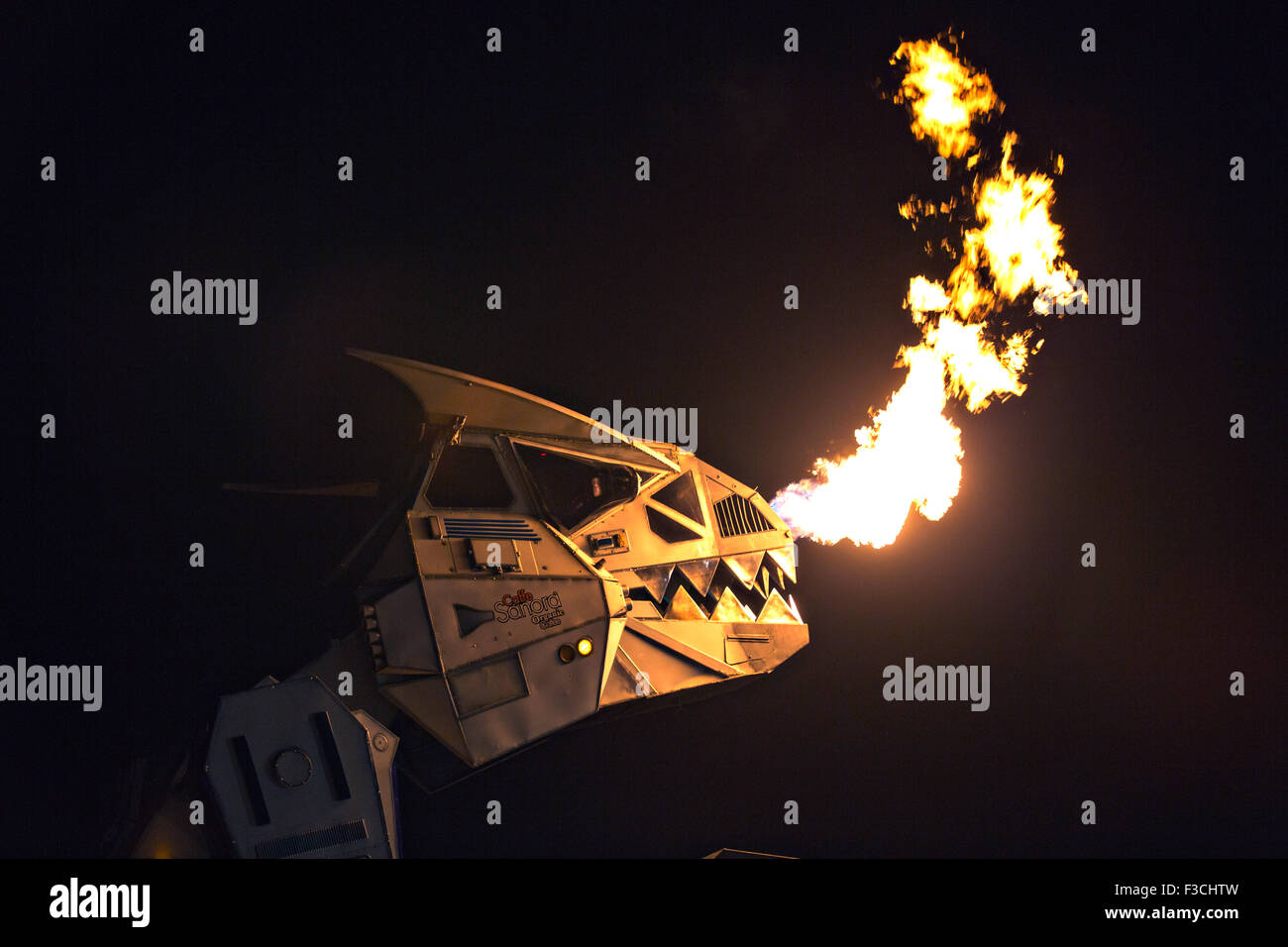 Robosaurus, a transforming giant dinosaur robot shoots fire during a ...