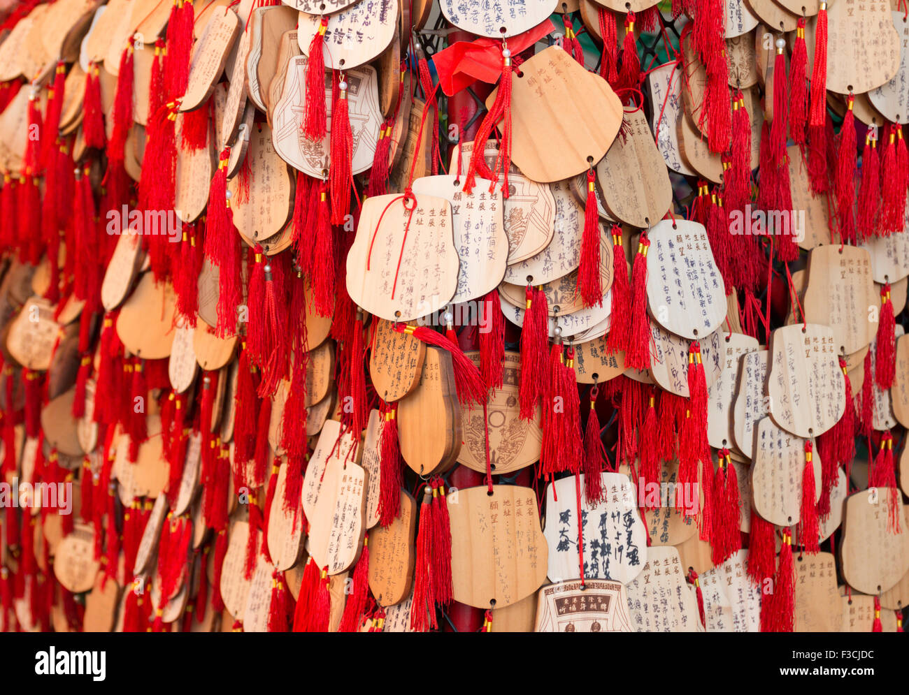 Cards with good luck wishes are hung at the Donglong Temple in Donggang ...