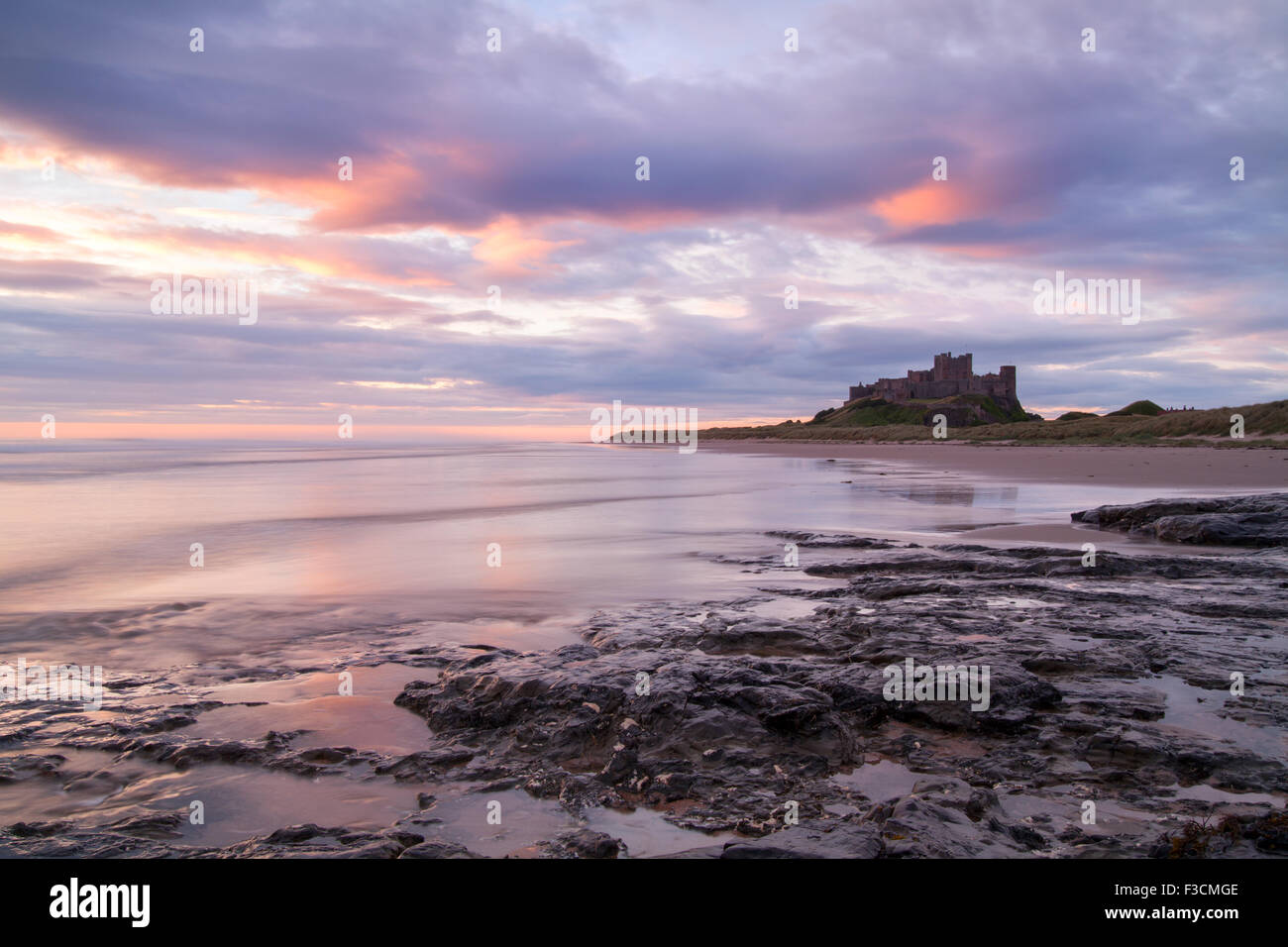 "Bamburgh Castle" sunrise Northumberland uk coast Stock Photo - Alamy