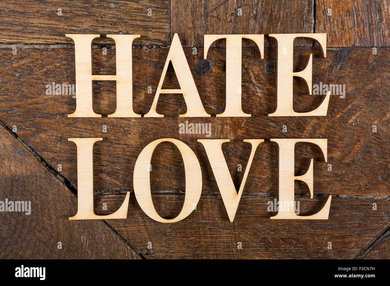 Wooden letters forming words LOVE & HATE written on old vintage wooden ...