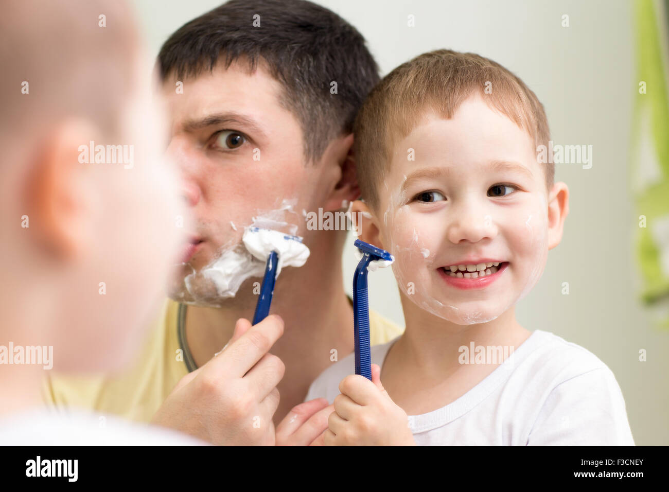 Boy child looking in mirror hi-res stock photography and images - Alamy