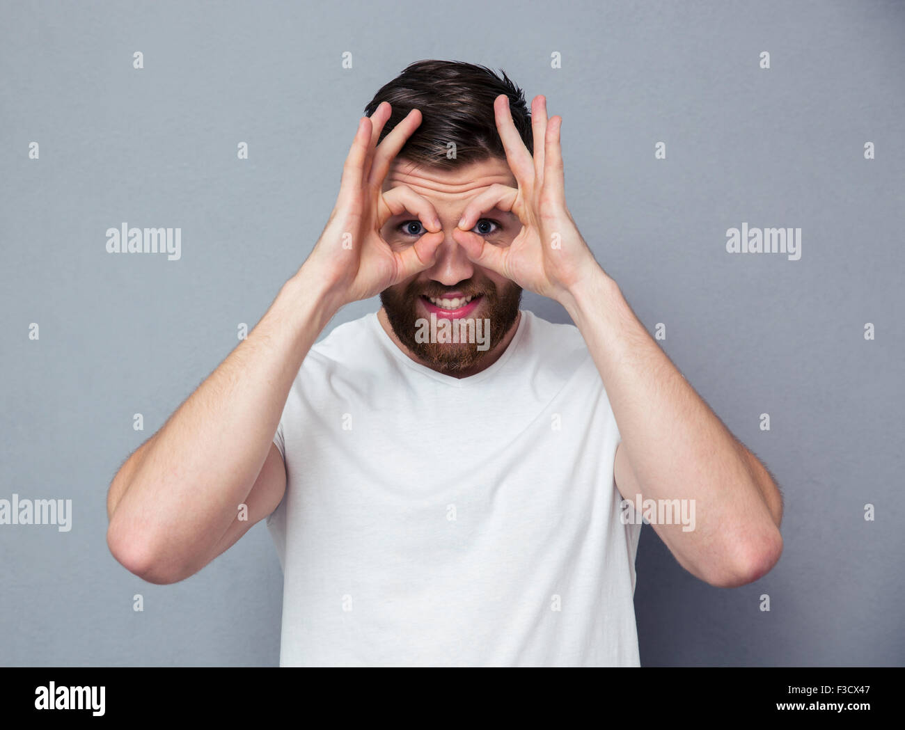 Portrait eyes looking through fingers hi-res stock photography and ...