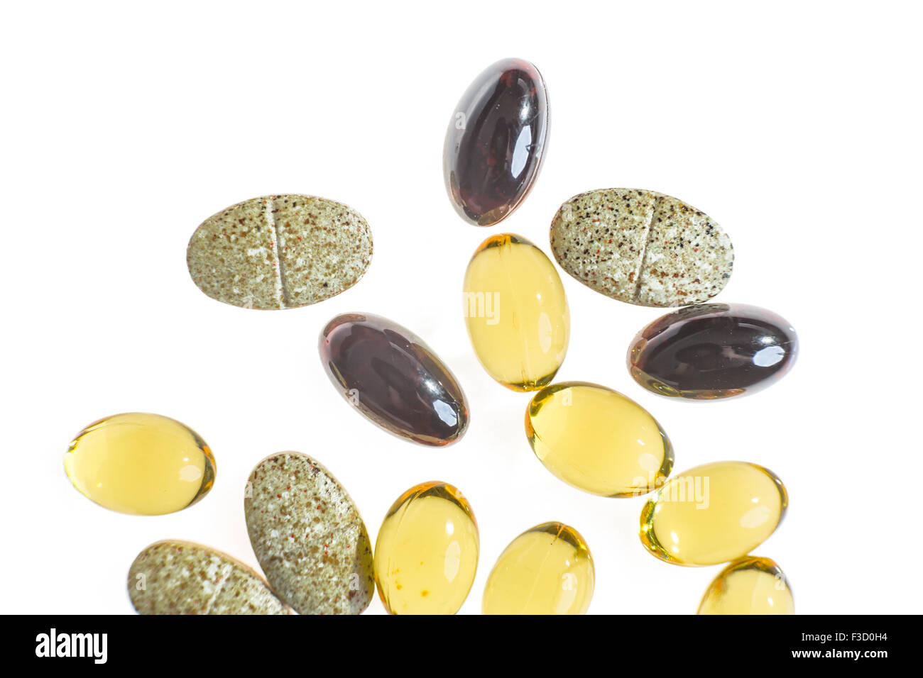 Different colored medicine and types of pills isolated on a white ...