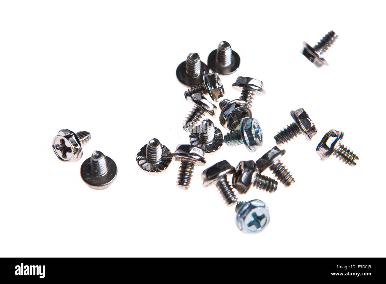 Computer screws against white background Stock Photo - Alamy