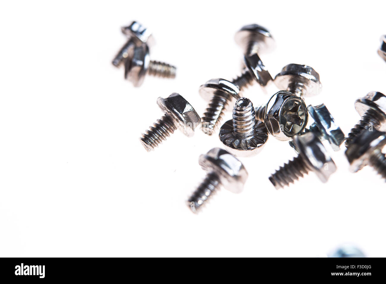 Computer screws against white background Stock Photo - Alamy