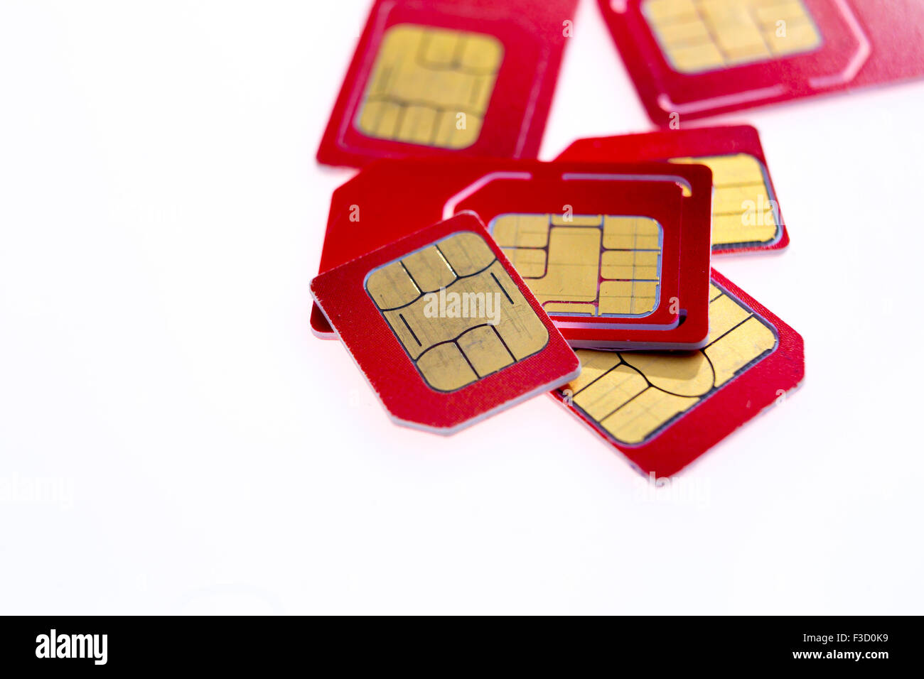 Stack of red sim card on white background Stock Photo - Alamy