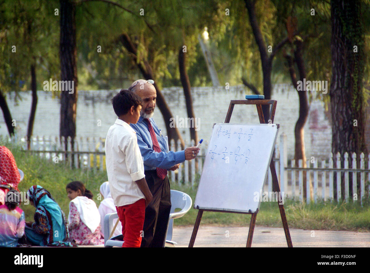Islamabad, Pakistan. 5th Oct, 2015. A teacher teaches students on World ...