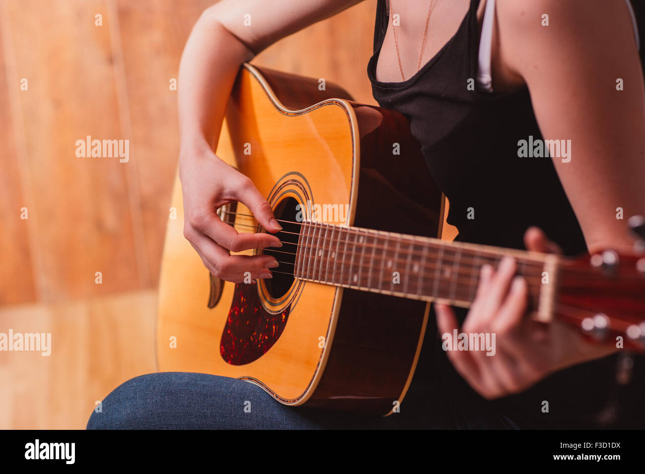 woman's hands playing acoustic guitar, close up Stock Photo - Alamy