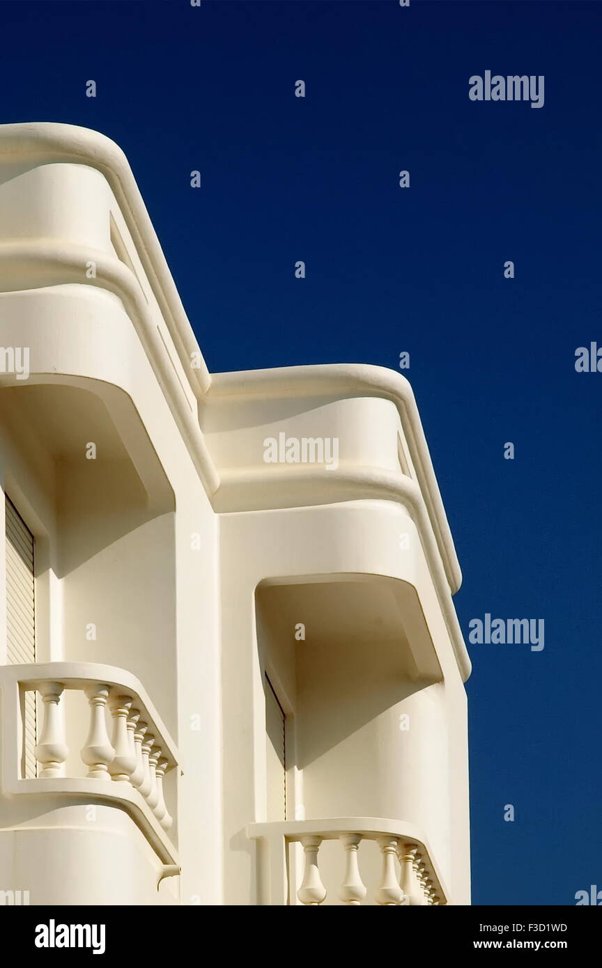 White traditional portuguese building white balconies Stock Photo - Alamy