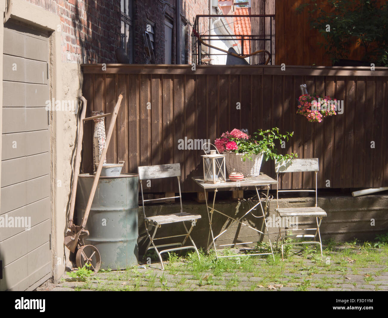 Sunny back yard with inviting table and chairs, encountered on a ...