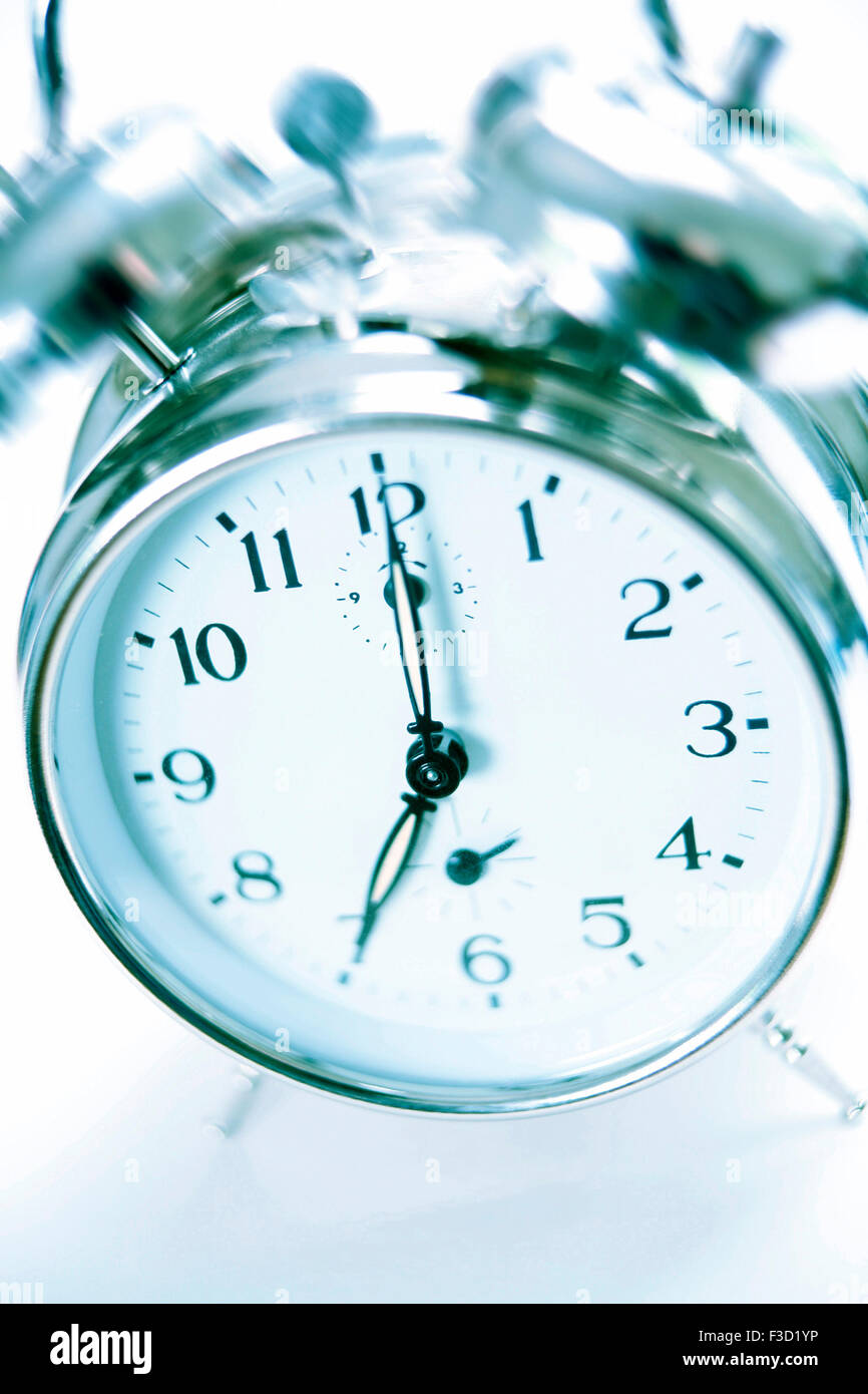 Ringing Alarm Clock On White Background Stock Photo - Alamy