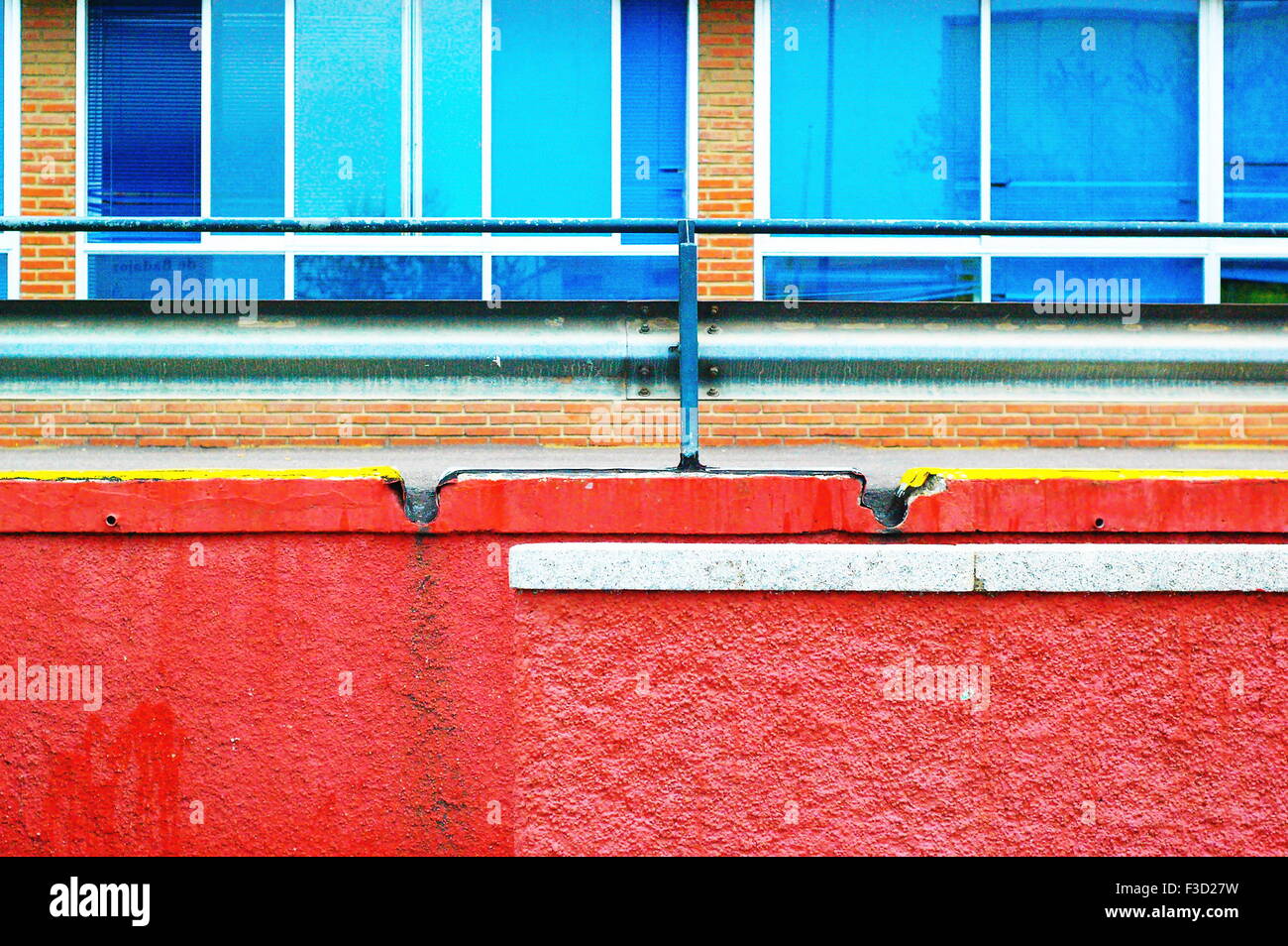 Exterior wall of a public hospital with vivid red and blue colors Stock ...