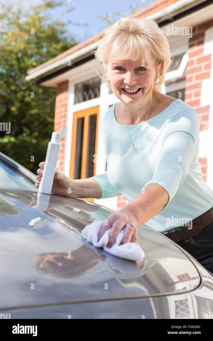 Old woman cleaning car hi-res stock photography and images - Alamy