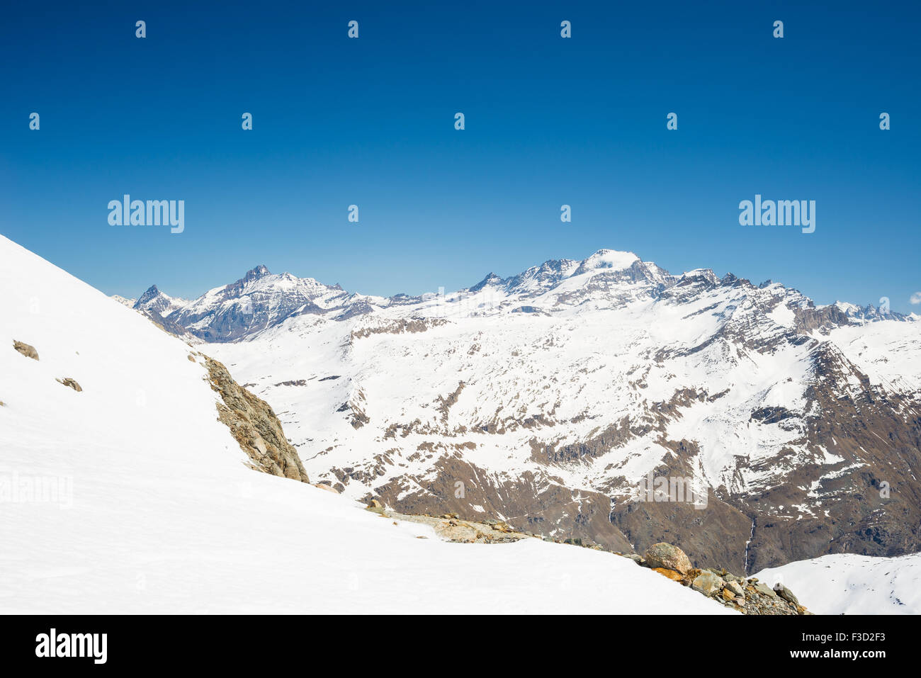 Stunning view of high mountain peaks arising from the alpine arc, in a ...