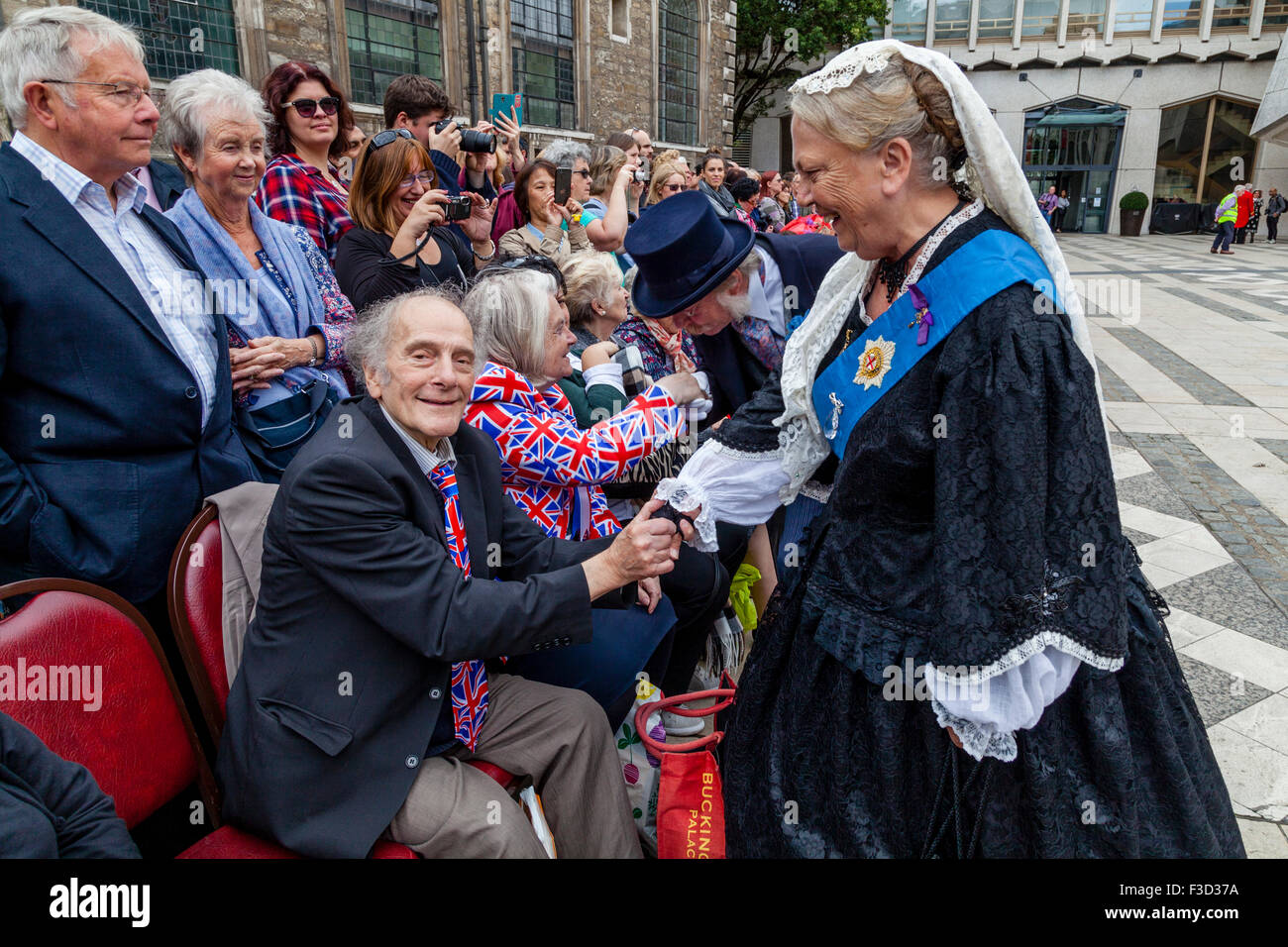 A Couple In Victorian Costume Entertain The Crowd At The Annual Pearly ...