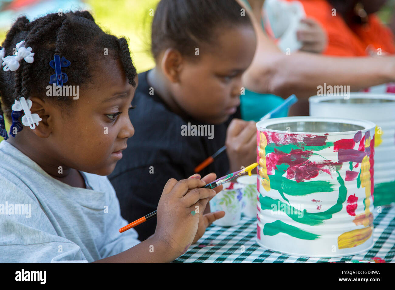 Detroit, Michigan - Children work on an art project in a park created ...